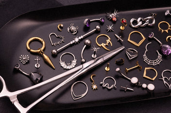 The Ultimate Guide to Barbell Piercings - Custom Plugs